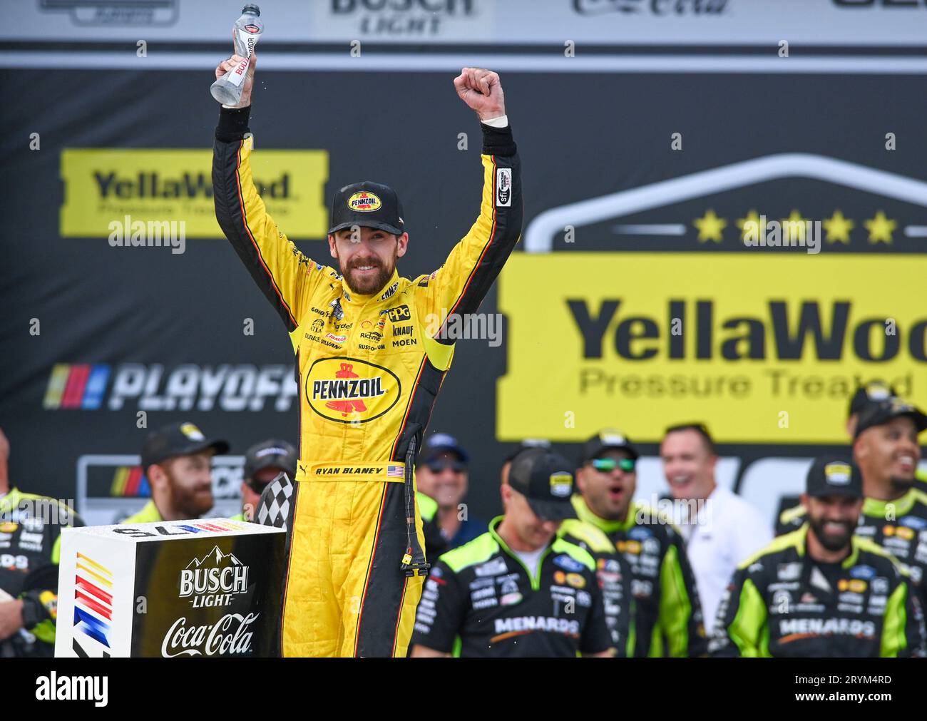 Ryan Blaney, front left, celebrates after winning a NASCAR Cup Series ...