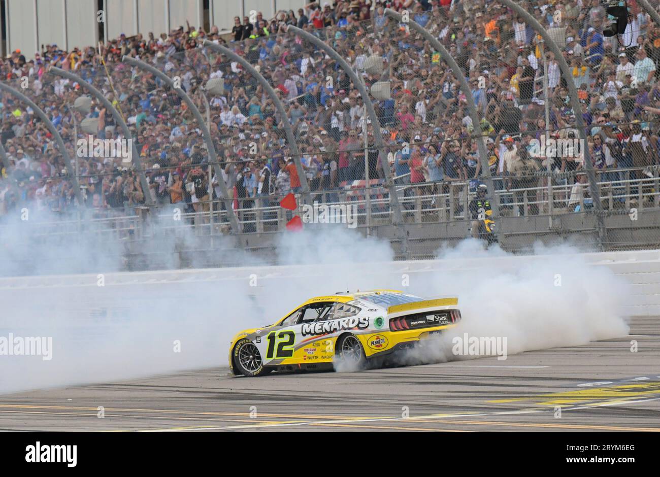 Ryan Blaney celebrates with a burnout on the track after winning a ...