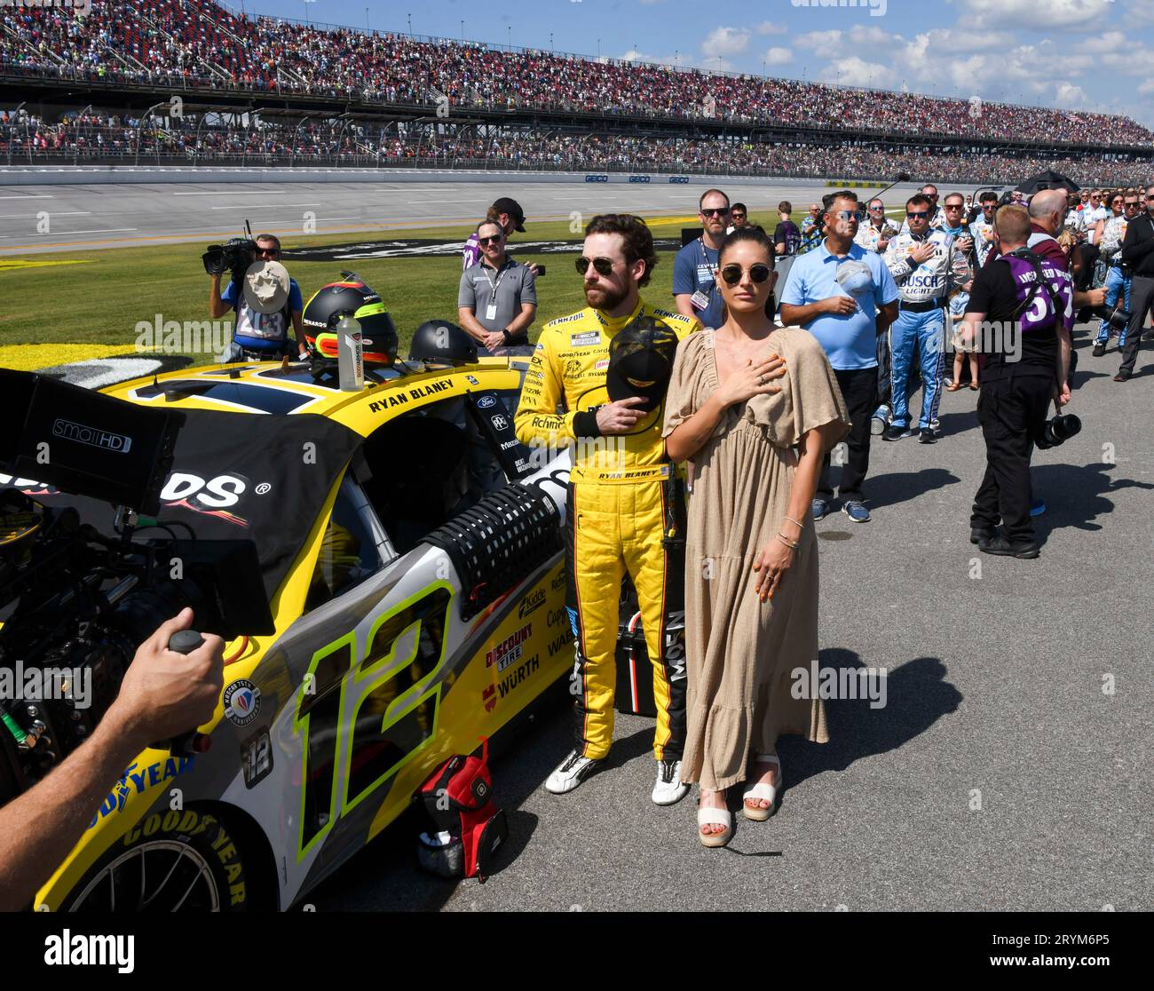 Driver Ryan Blaney, center left, stands with his girlfriend Gianna ...