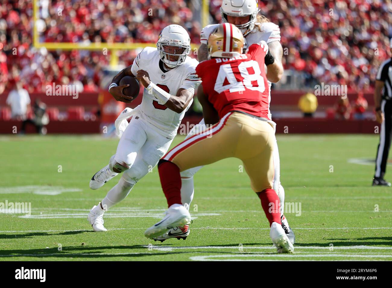 Arizona Cardinals quarterback Joshua Dobbs, left, runs against the San ...