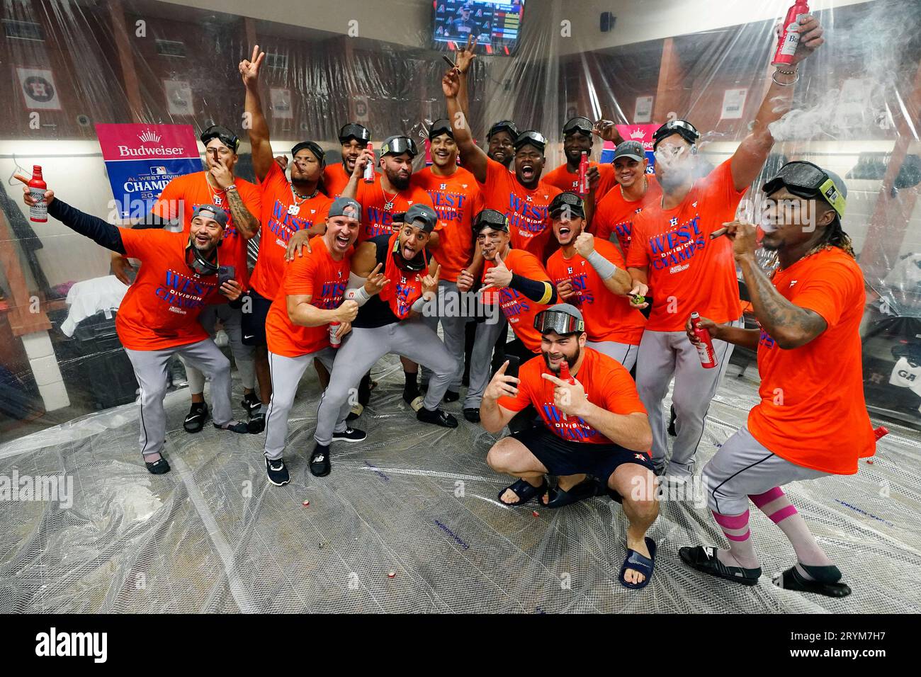 Houston Astros players celebrate in the locker room after clinching the ...