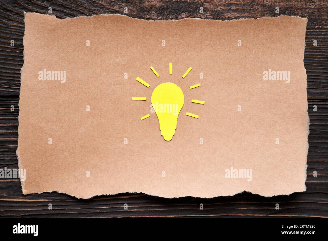 Creative idea and inspiration concept with paper light bulb on ripped ...