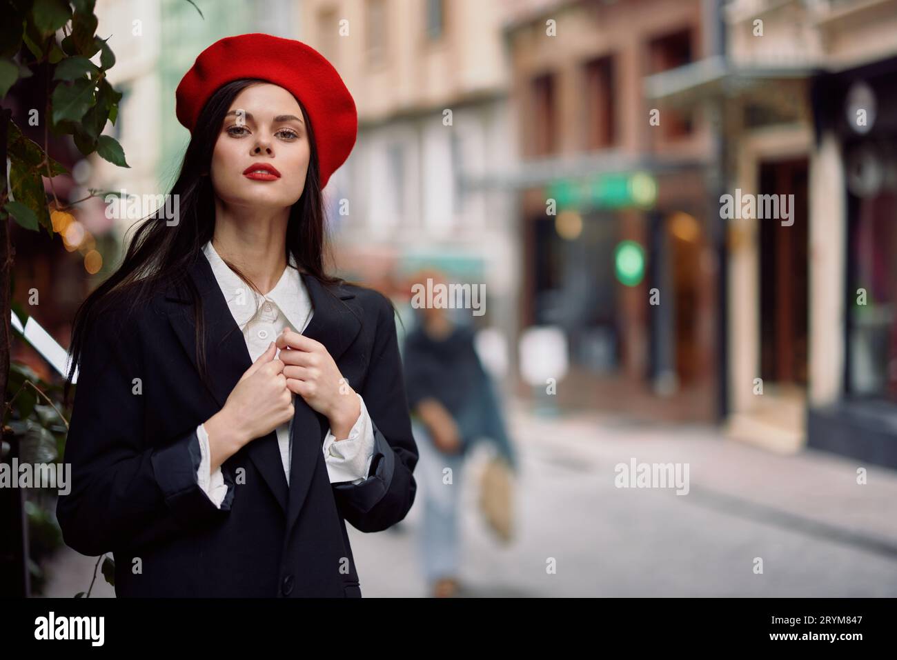 Woman walking down an old city street in a crowd, sociophobia, fear of ...