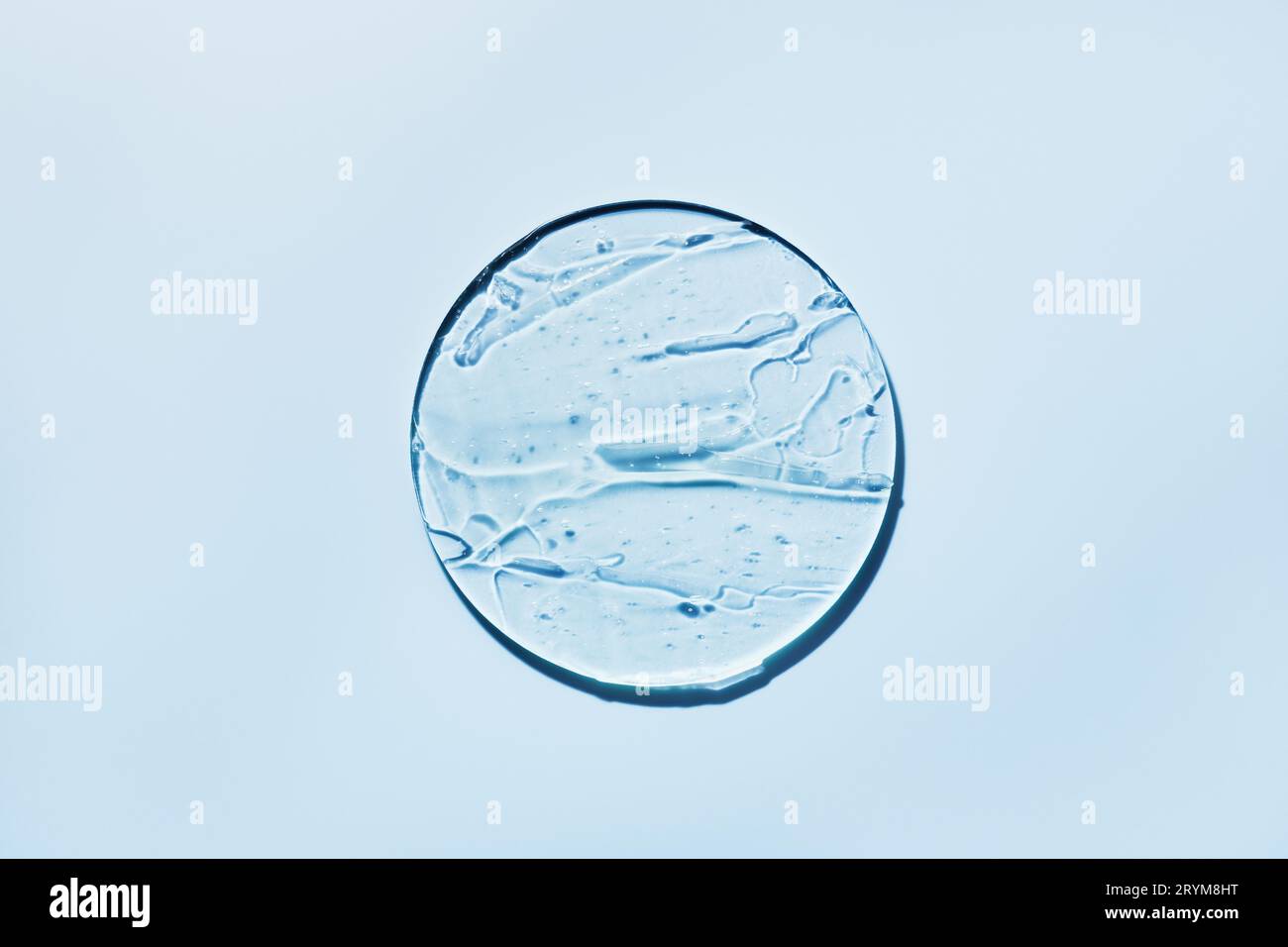 Sample of gels cosmetic product in petri dish on blue background, hard ...
