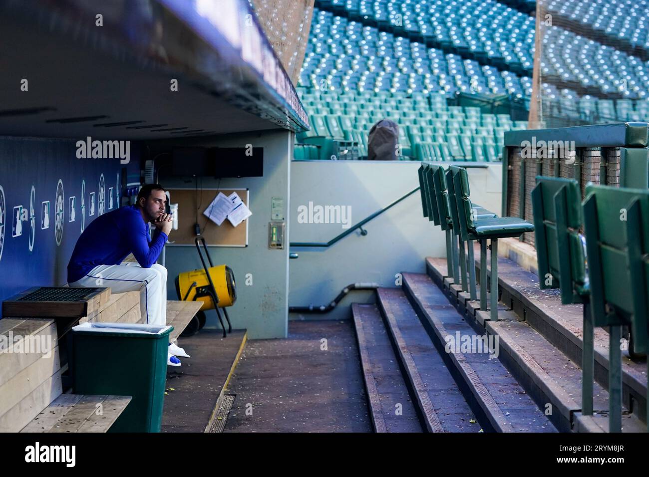 Seattle Mariners relief pitcher Tayler Saucedo sits in the dugout in an ...