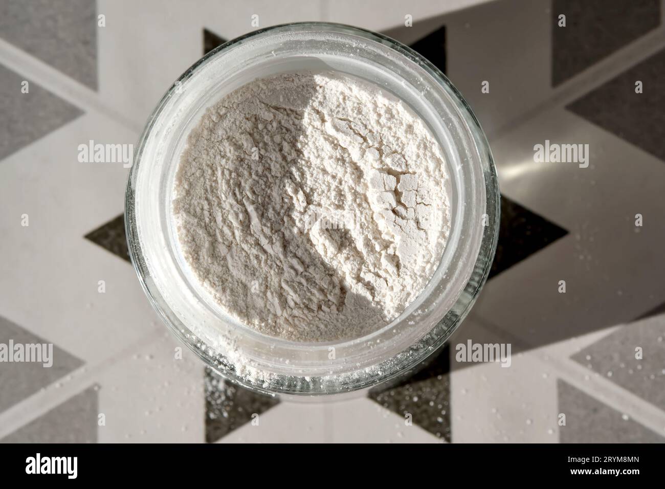 An open jar of face scrub-powder showing off its texture Stock Photo ...