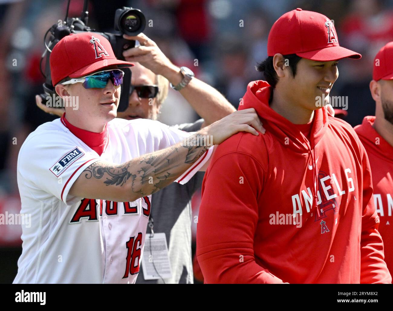 Los Angeles Angels Mickey Moniak, left, walks with Shohei Ohtani after ...