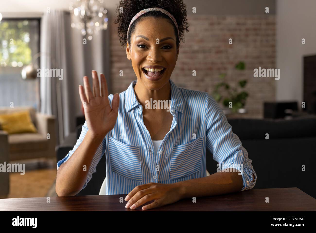 Portrait cheerful african woman waving hi-res stock photography and ...