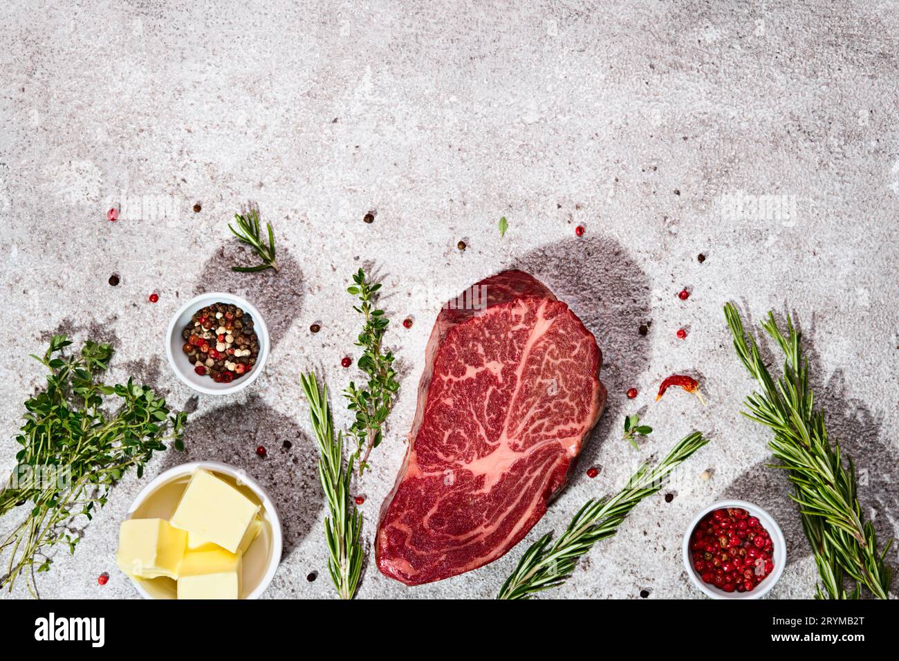 Food background with Fresh marbled beef rib eye steak, butter and ...
