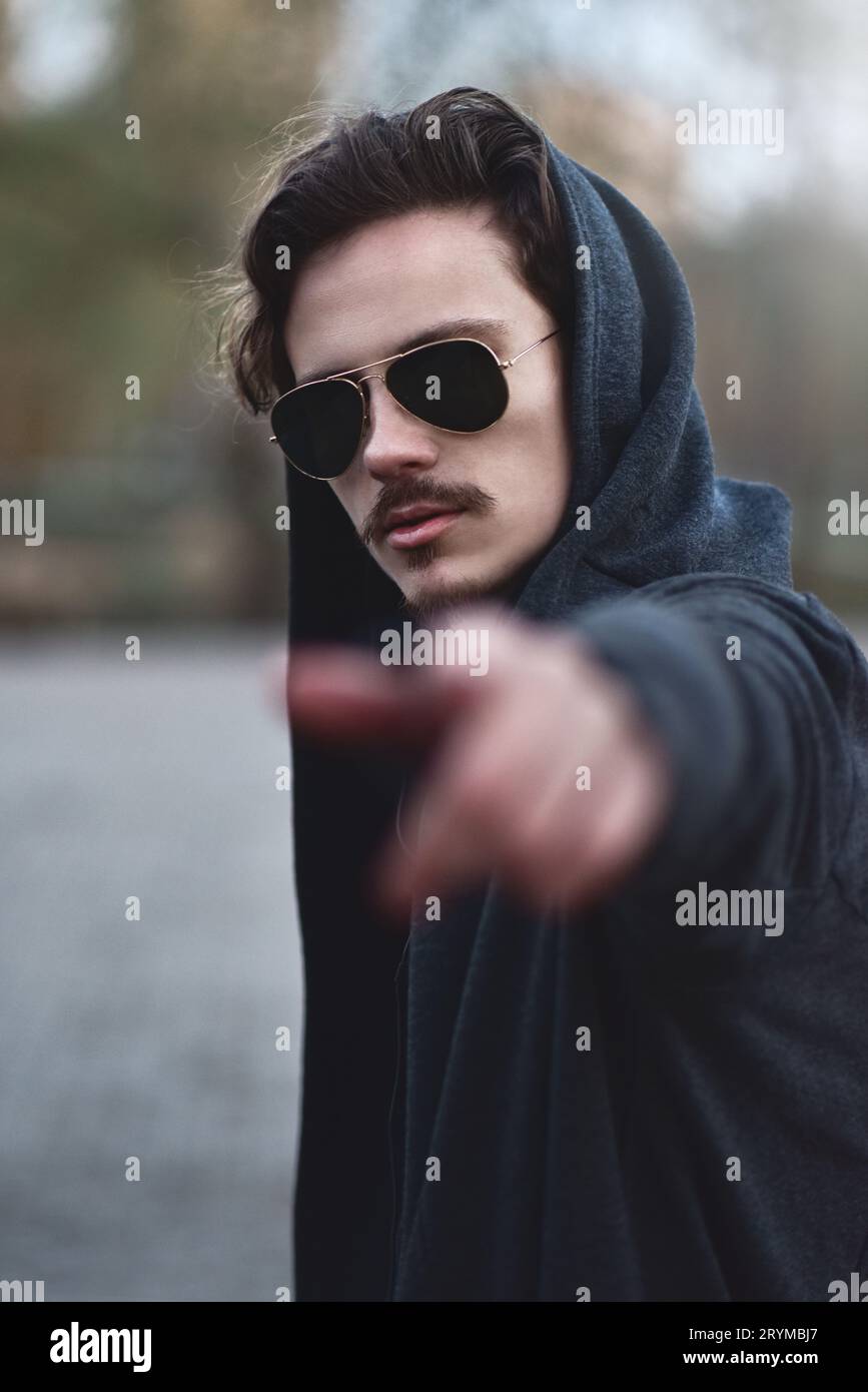 The guy points his finger at the camera, calling for action Stock Photo ...