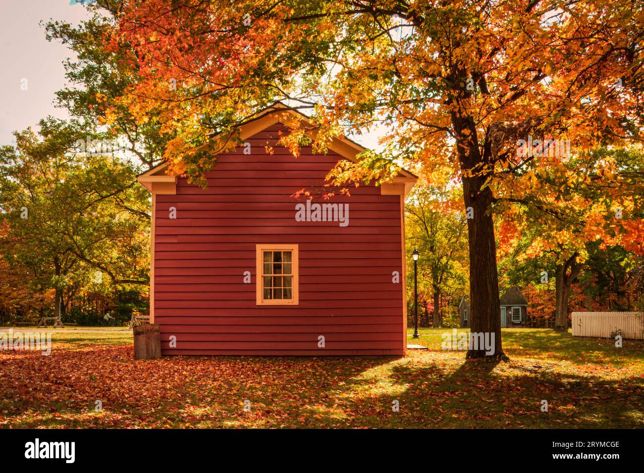 A small red house blends with the autumn foliage , canadian fall ...