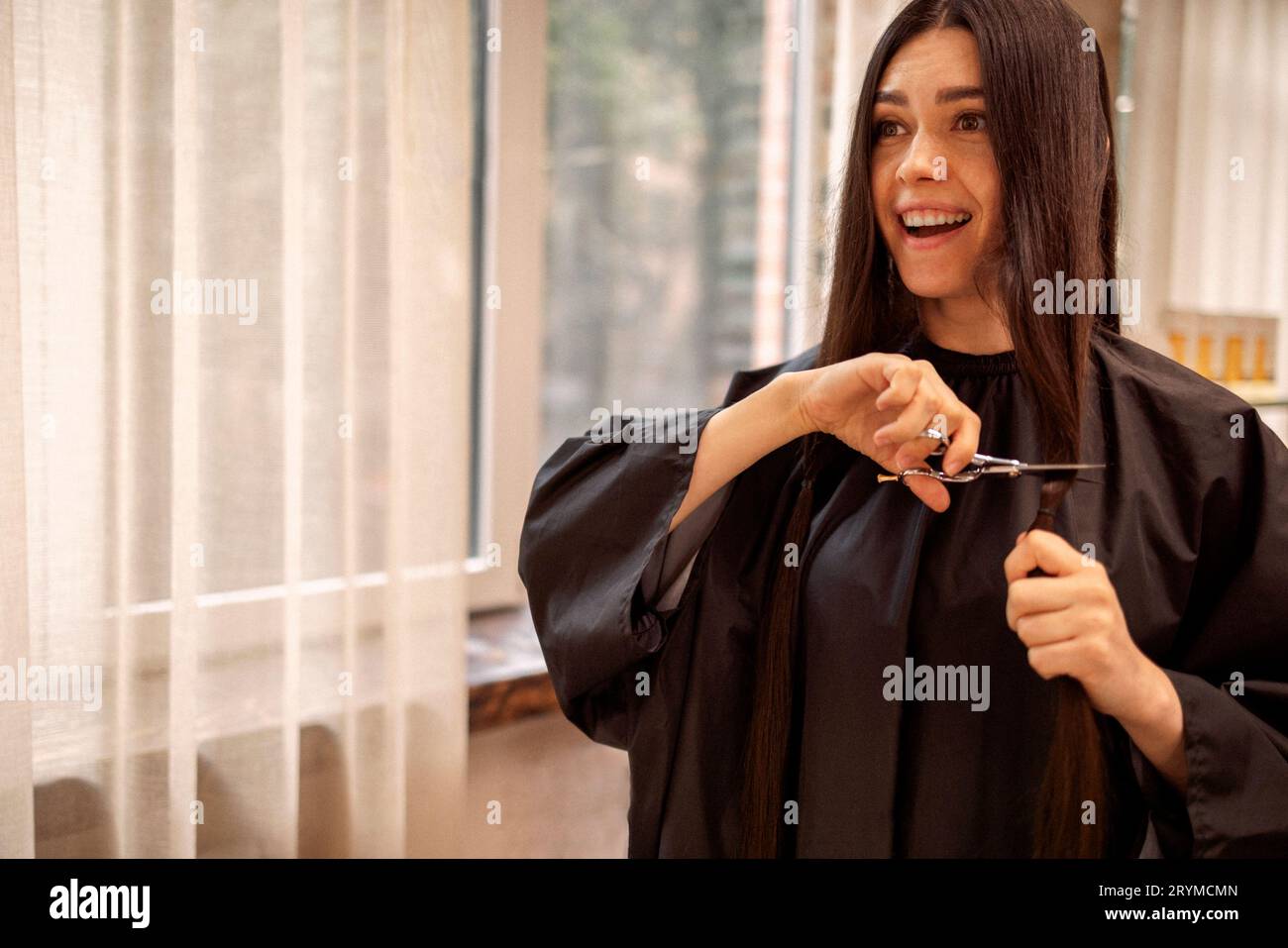 Girl hair cut scissors hi-res stock photography and images - Alamy
