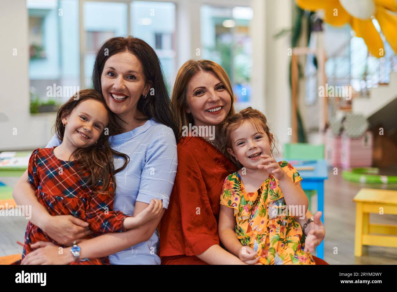 Preschool teacher child hugging hi-res stock photography and images - Alamy