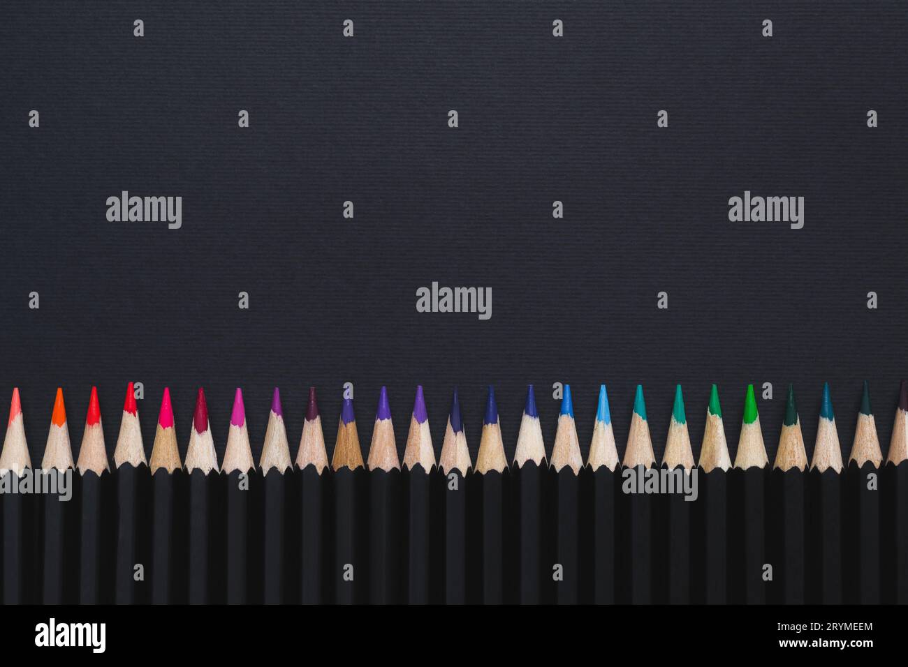 Minimal Stationery backdrop.Colored pencil set arranged in line on ...