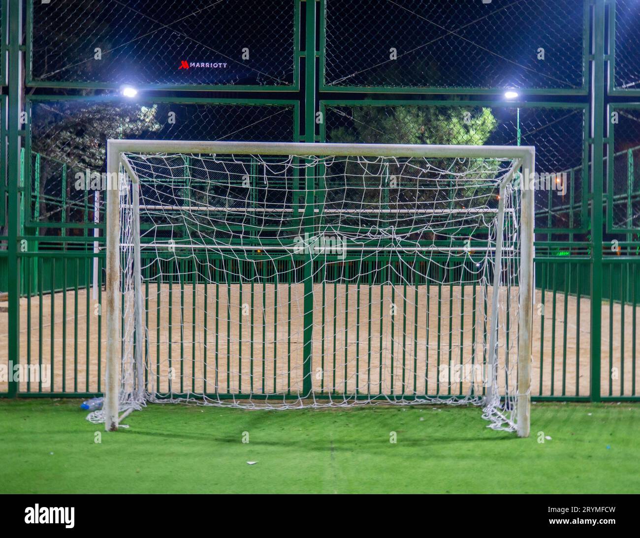 football field in the evening. Artificial lawn. Available ...