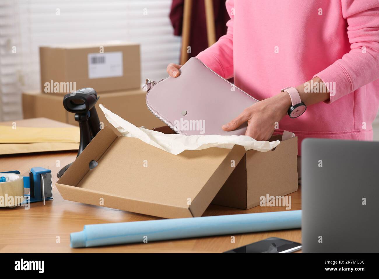 Female worker packing box in warehouse hi-res stock photography and ...