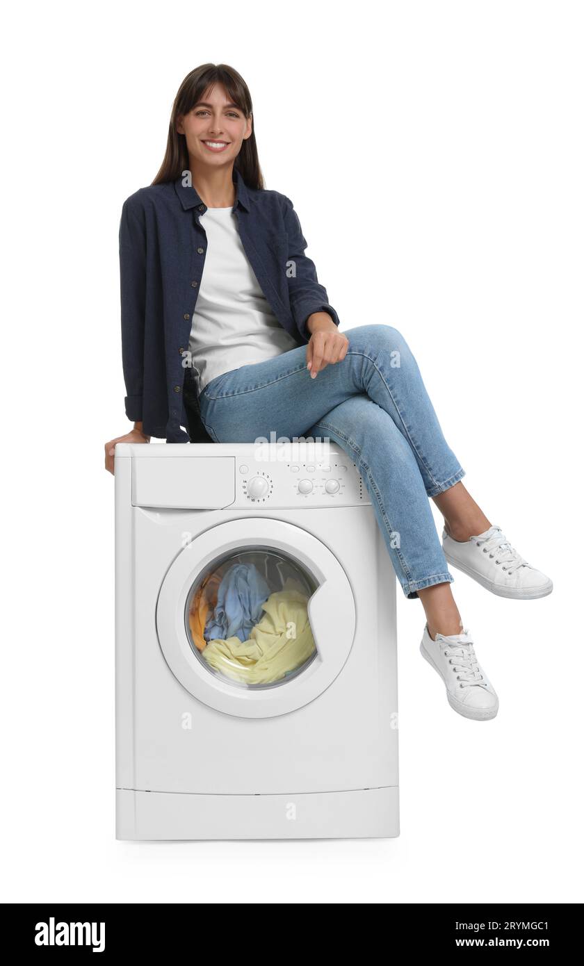 Woman sitting on washing machine Cut Out Stock Images & Pictures - Alamy