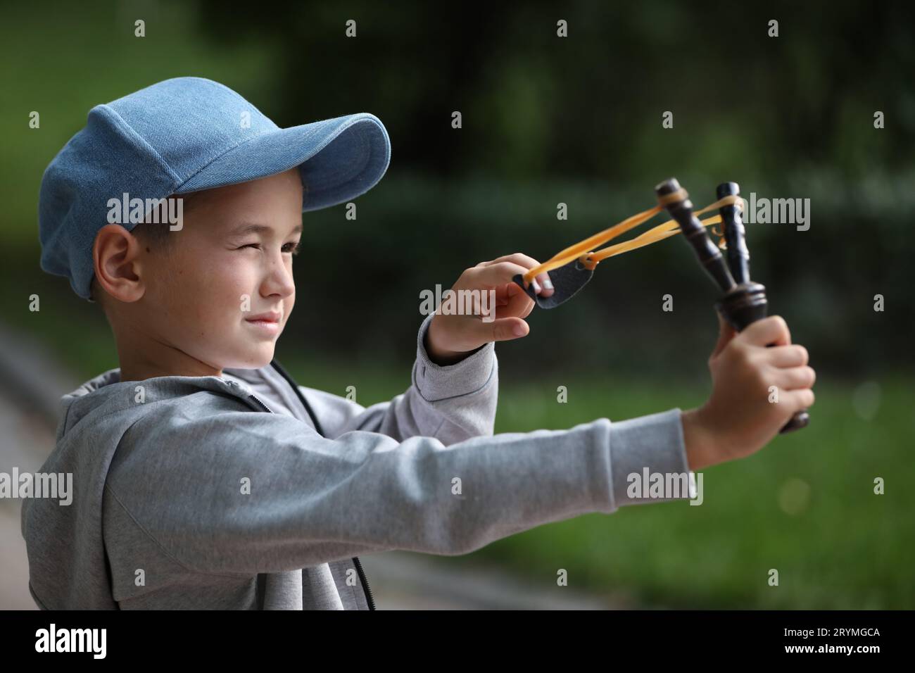 Aim boy catapult child outside hi-res stock photography and images - Alamy