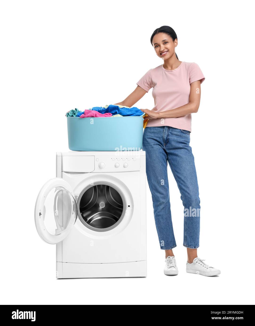 Beautiful woman with laundry basket near washing machine on white background Stock Photo - Alamy