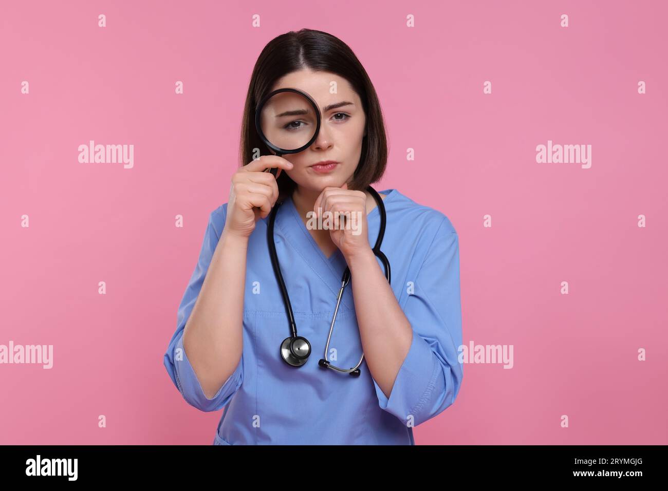 Magnifying glass doctor searching hi-res stock photography and images ...