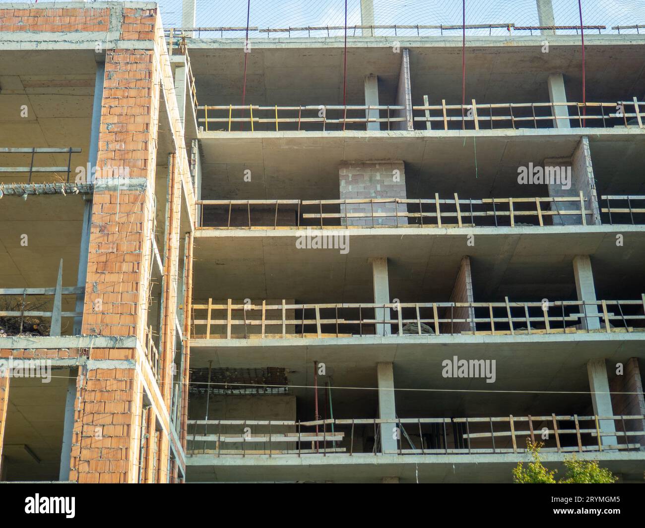 Construction is in full swing. House made of red blocks and reinforced ...