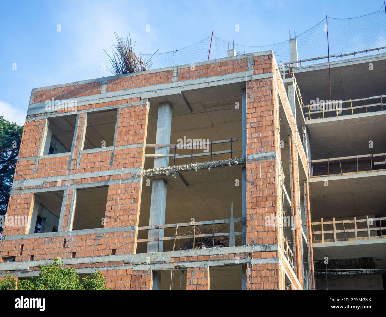 Construction is in full swing. House made of red blocks and reinforced ...