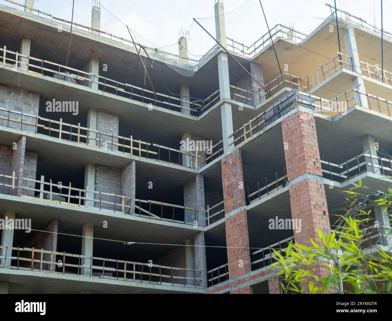 Construction is in full swing. House made of red blocks and reinforced ...