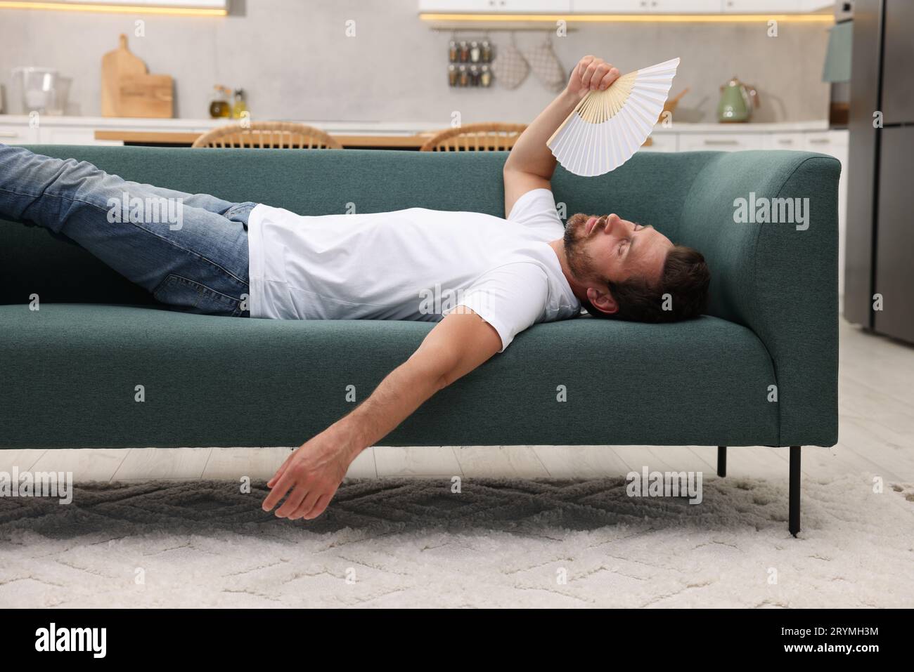 Fanning himself fan hi-res stock photography and images - Alamy