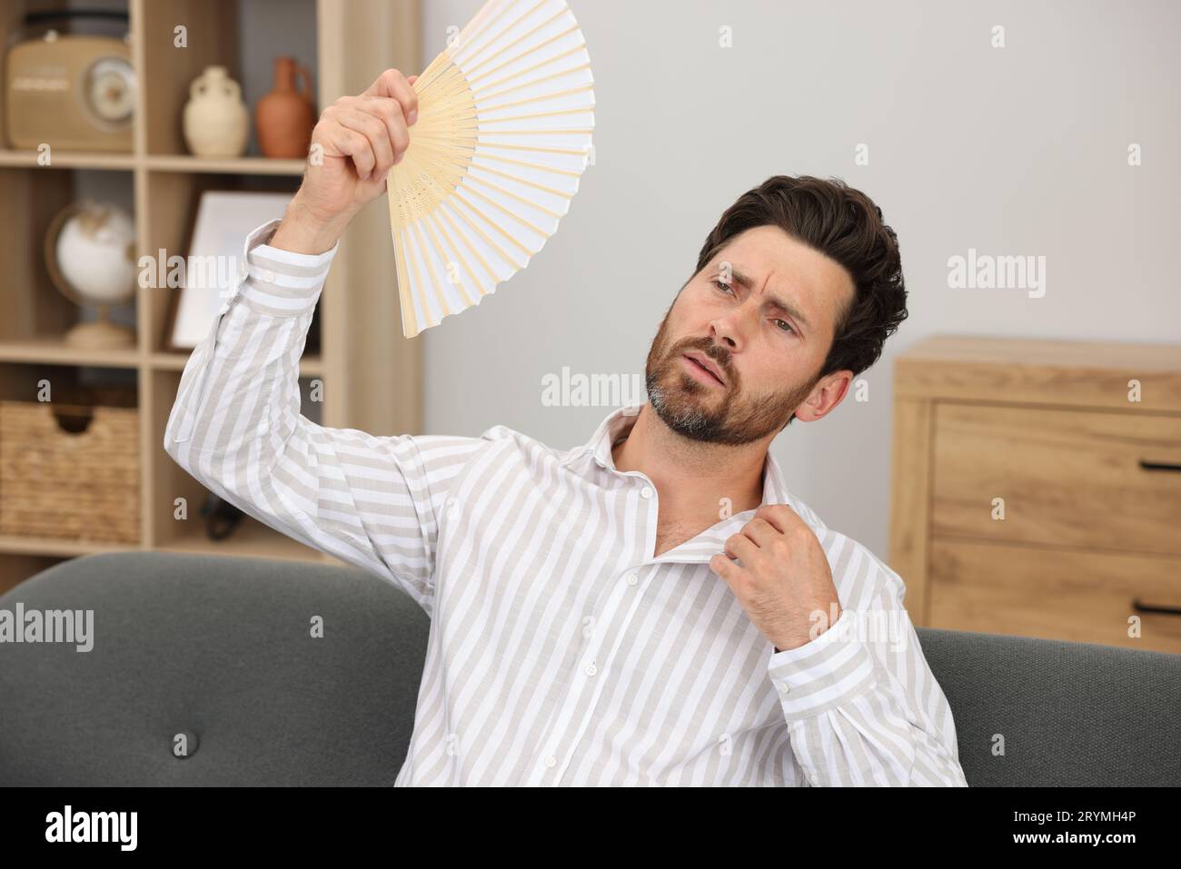Fanning himself fan hi-res stock photography and images - Alamy