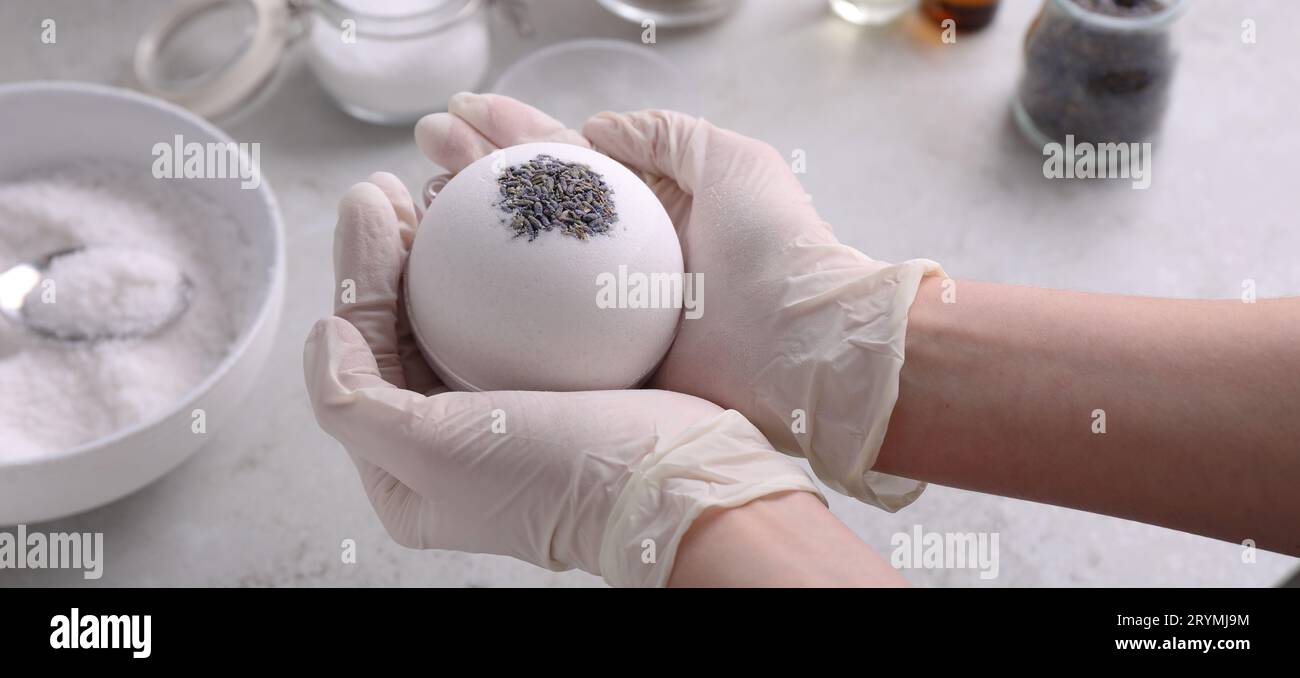 Woman making bath bomb at table, closeup. Banner design Stock Photo - Alamy