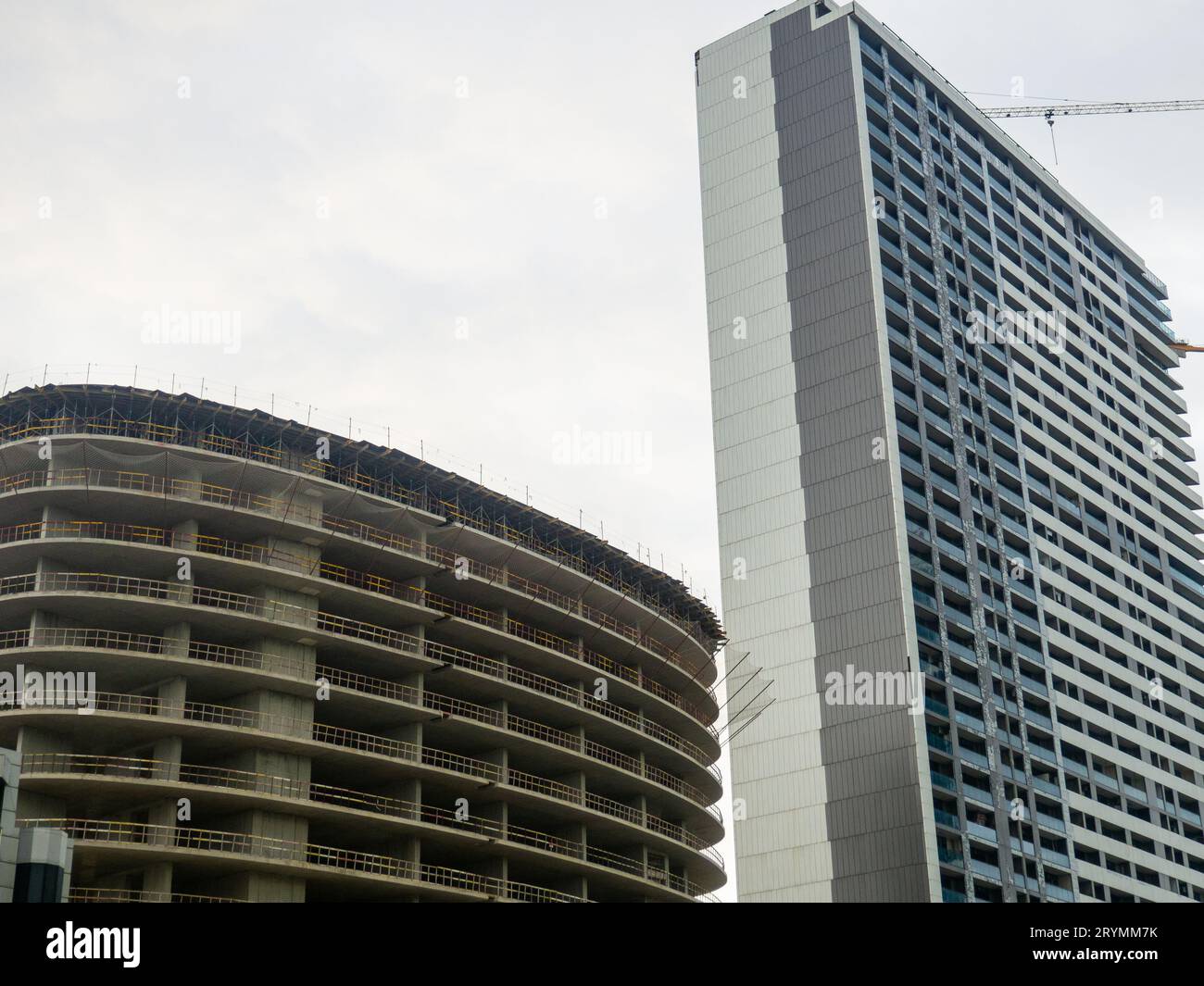 Construction of a high-rise building. Skyscraper glazing. Scaffolding ...
