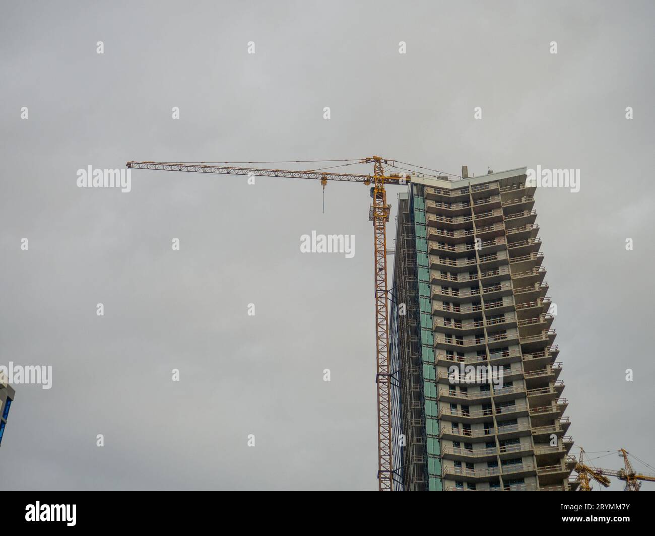 Construction of a high-rise building. Skyscraper glazing. Scaffolding ...