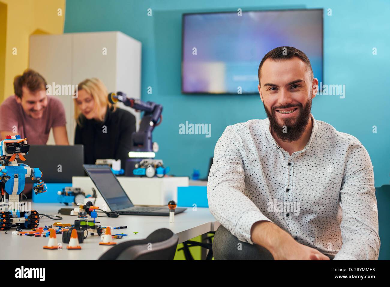 A Man Working In A Robotics Laboratory Focusing On The Intricate Fields Of Robotics And 3d