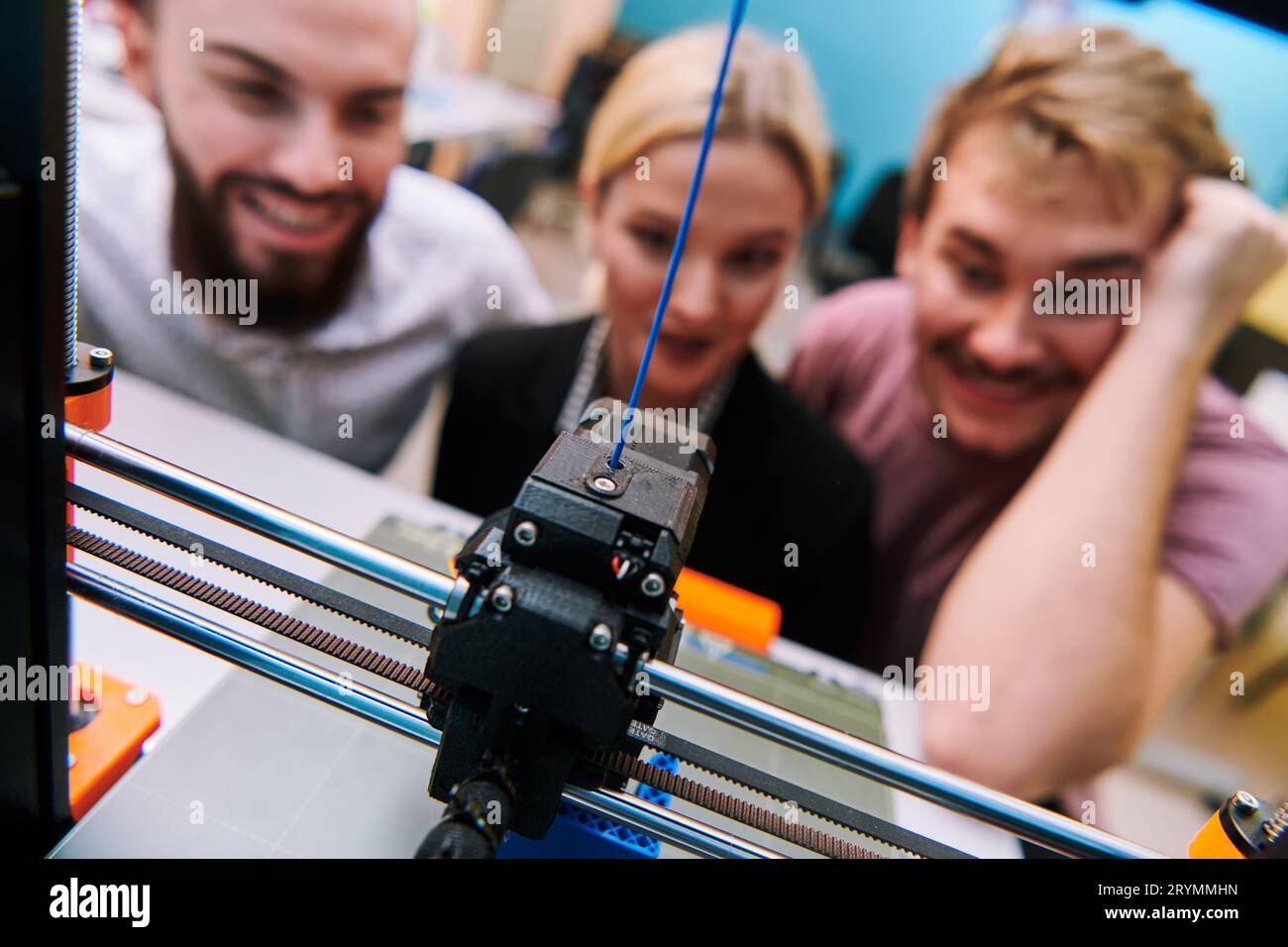 A group of colleagues working together in a robotics laboratory ...