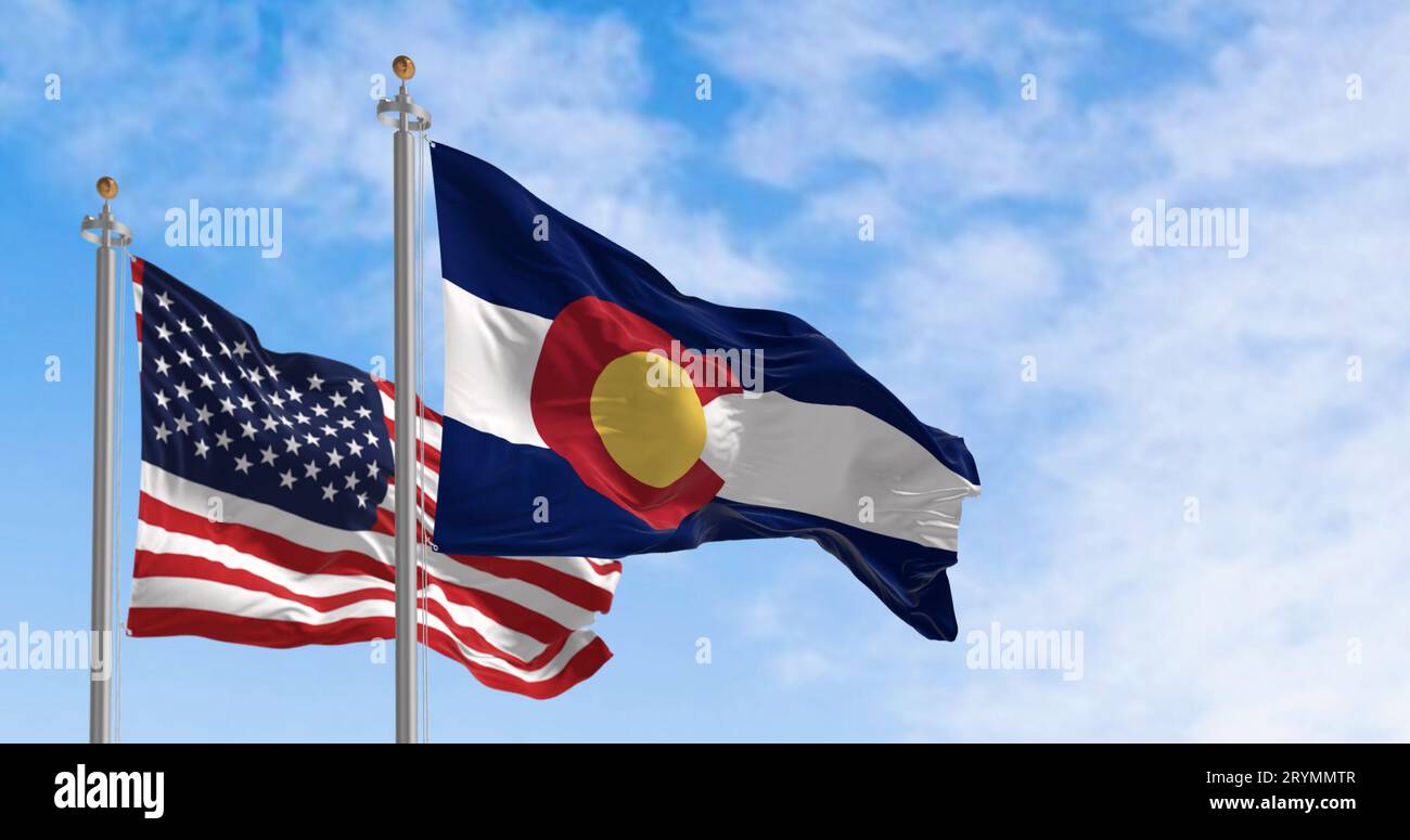 The Colorado state flag waving with the national flag of the US on a ...