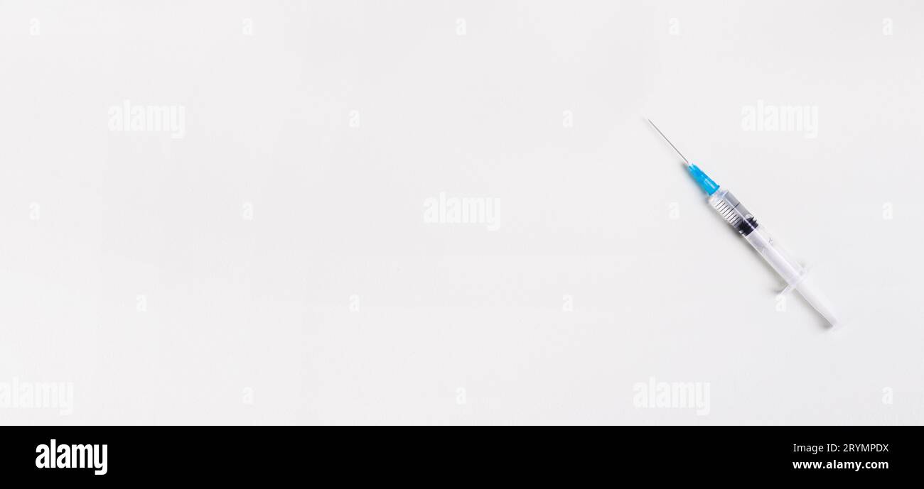 Vaccination concept. Syringe with vaccine on gray background. Banner ...