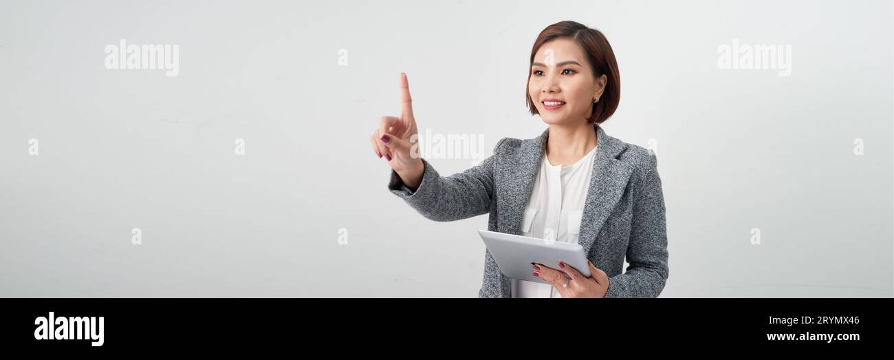 Beautiful asian businesswoman showing something hi-res stock ...