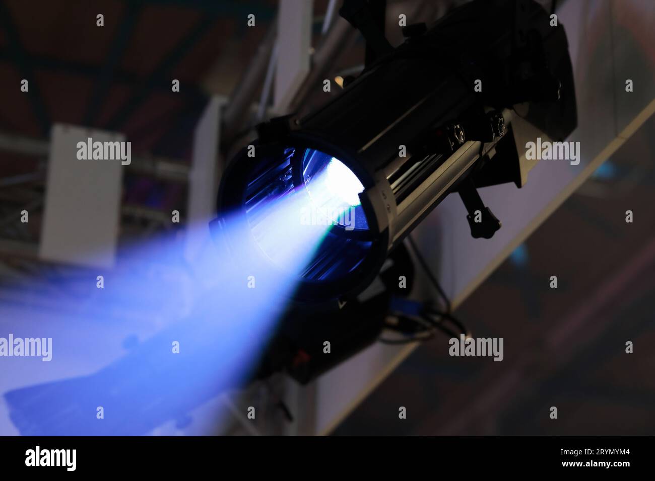 LED stage spotlight fixture and ray of blue light. Selective focus ...
