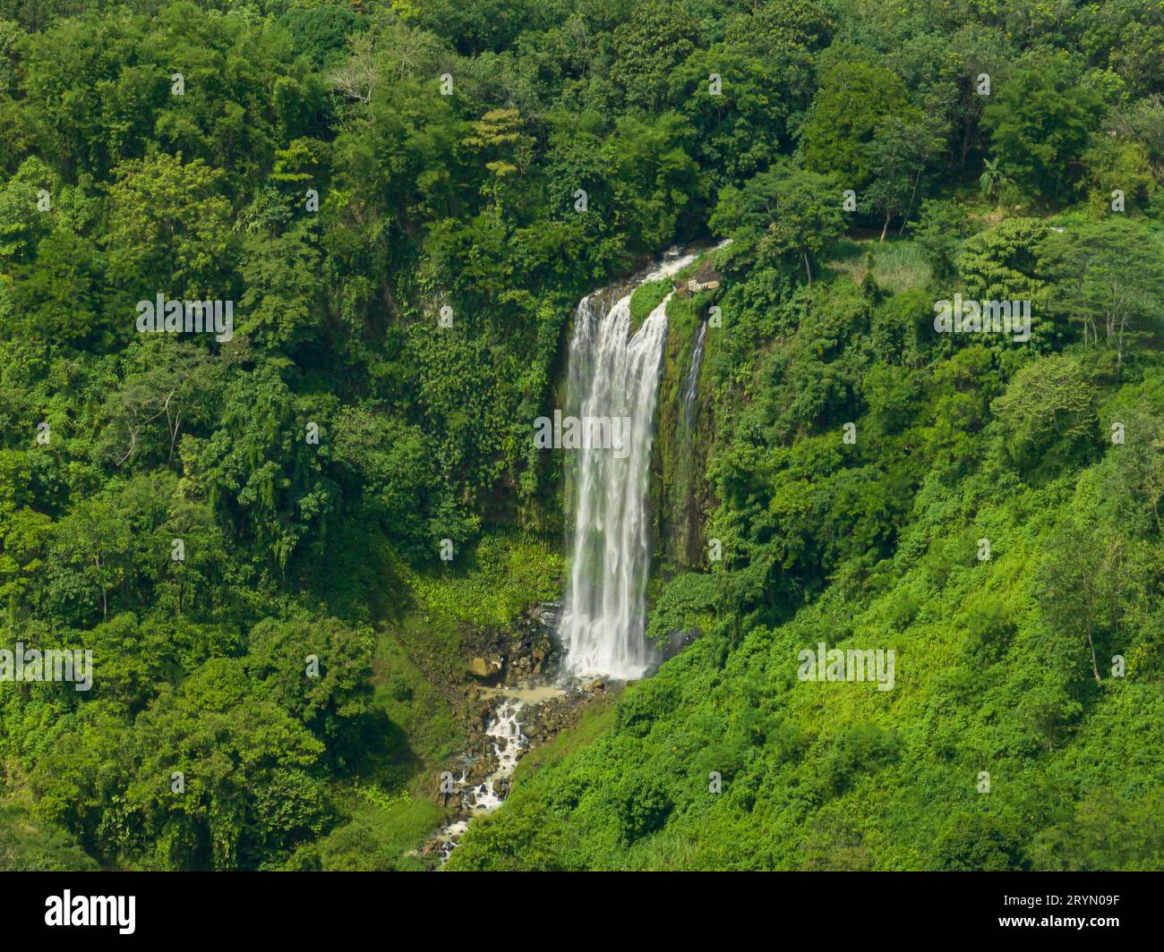 Beautiful water streaming down from a mountain. Lasang Falls. Bukidnon ...
