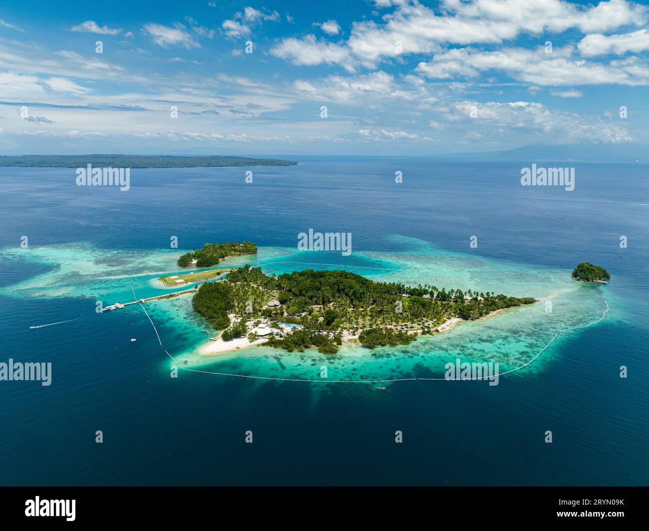 Malipano Islets with sandy beach. Blue sky and clouds. Samal ...
