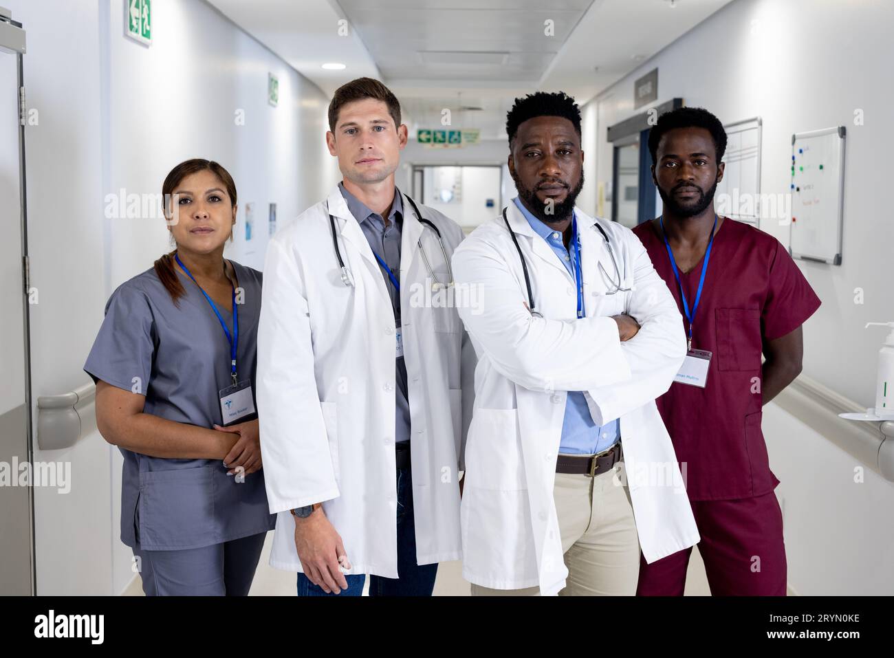 Unaltered portrait of diverse group of serious doctors standing in ...