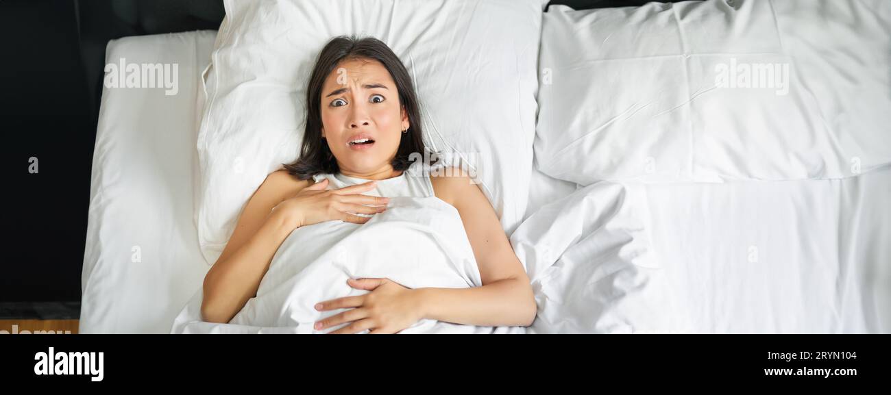 Portrait of young korean woman looks freaked out. Concerned asian girl ...