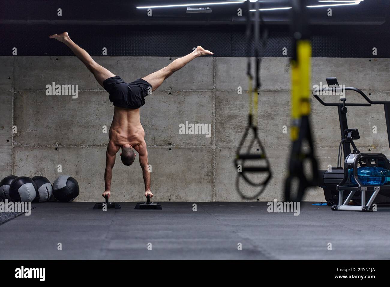 A muscular man in a handstand position, showcasing his exceptional ...