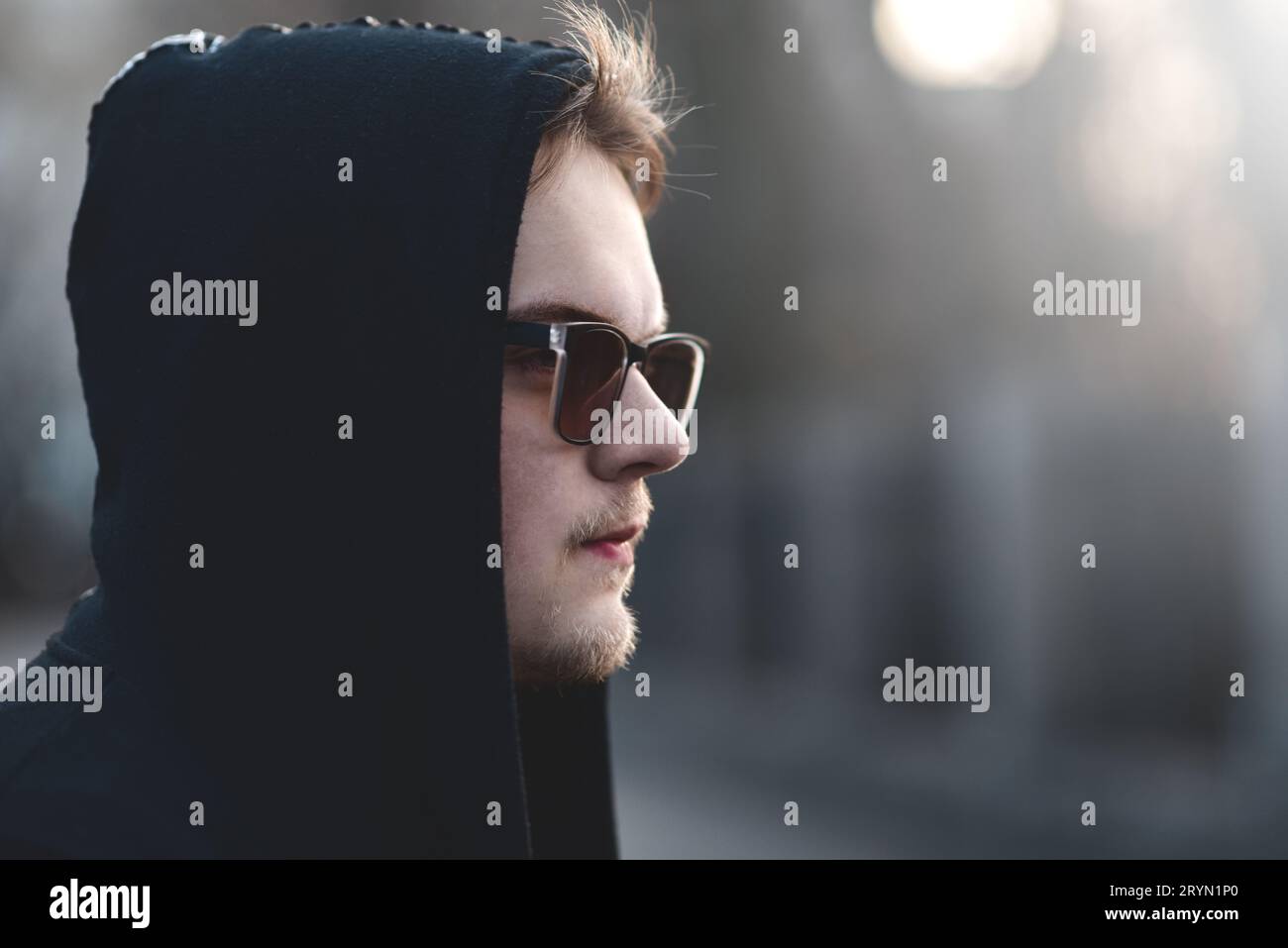 Closeup portrait of mysterious man in black hood and sunglasses Stock ...