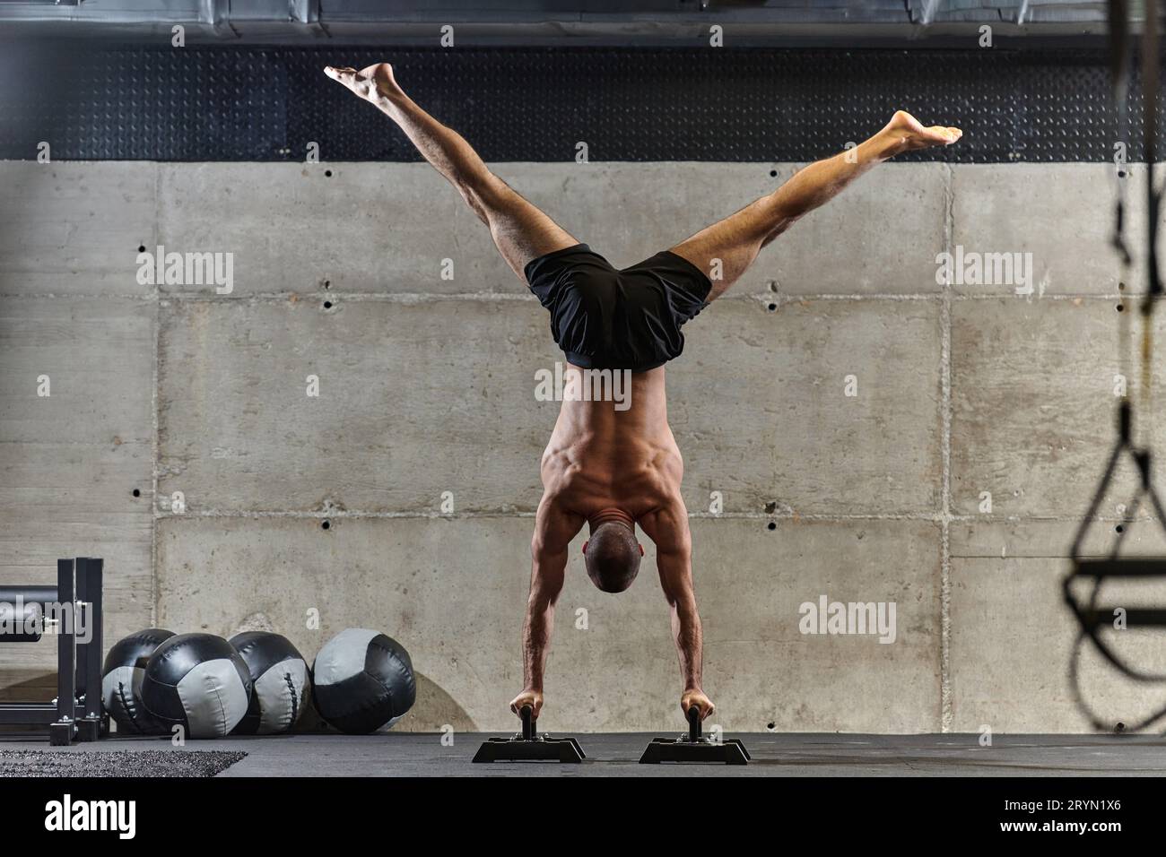 A muscular man in a handstand position, showcasing his exceptional ...