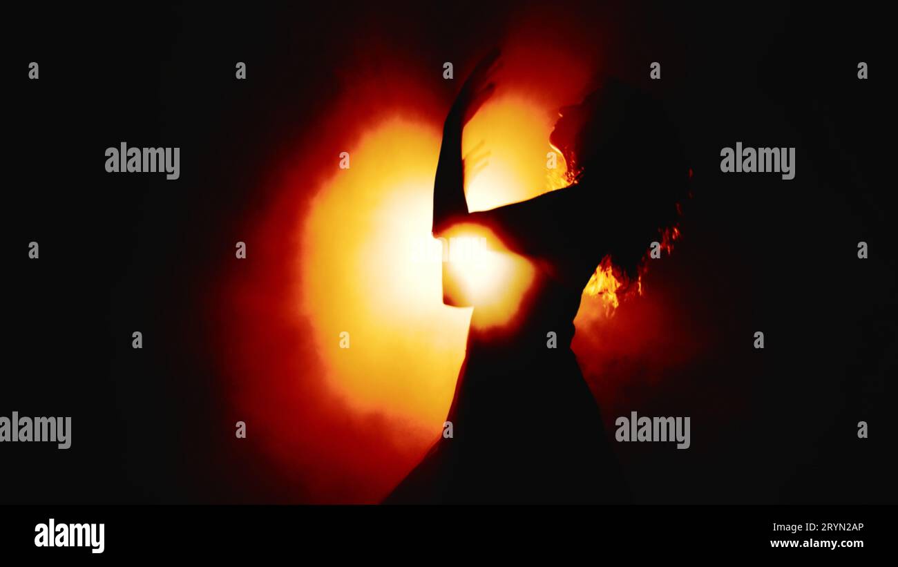 Silhouette dancing contemporary woman spot light Stock Photo - Alamy