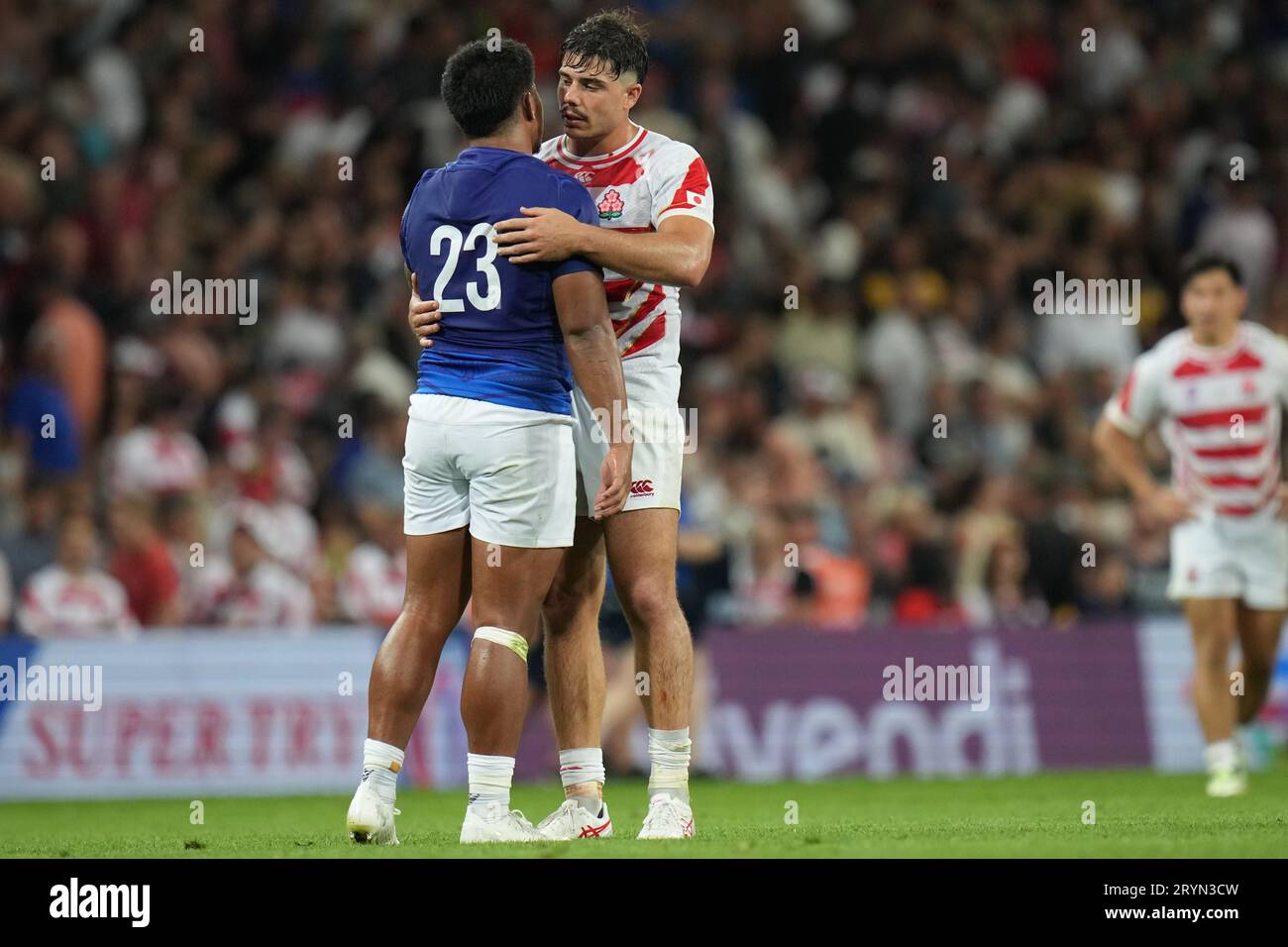Japan's Dylan Riley greets with Samoa's Danny Toala after winning the ...