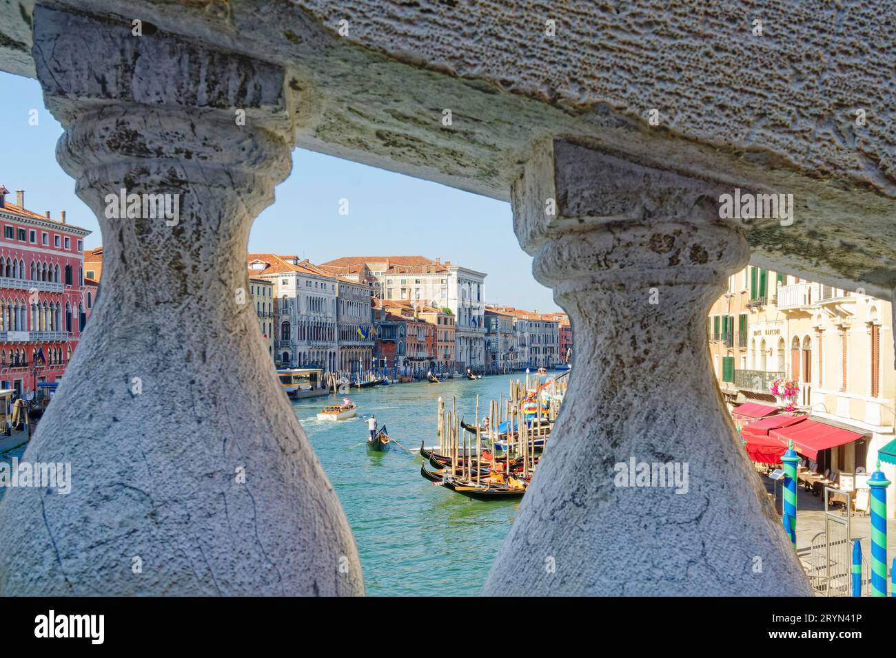 View through the stone railing of the Rialto Bridge onto the Grand ...
