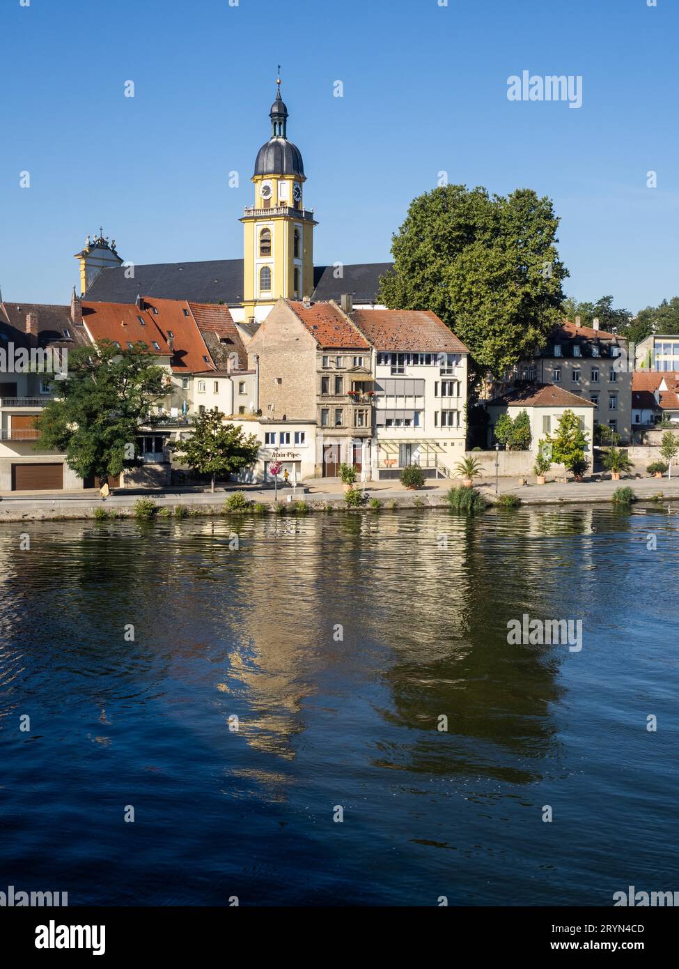 View of the town church, reflection in the river Main, Kitzingen, Lower ...