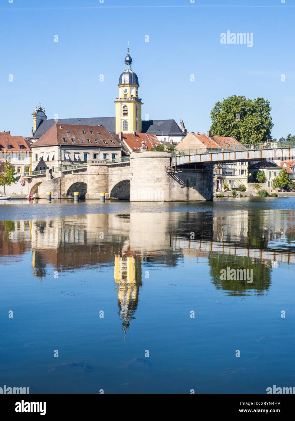 View of the town church and the old Main bridge, stone arch bridge ...
